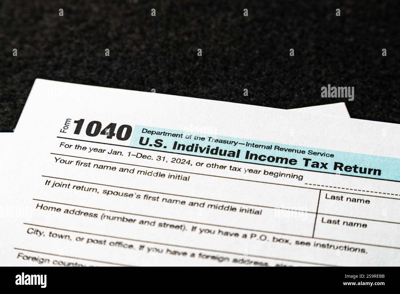 Federal income tax return preparation with 1040 form and calculator for ...