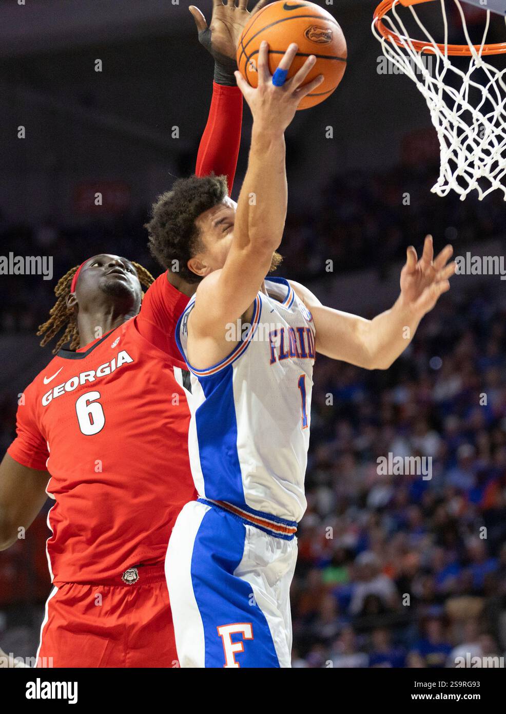 Florida guard Walter Clayton Jr. (1) shoots under pressure from Georgia ...