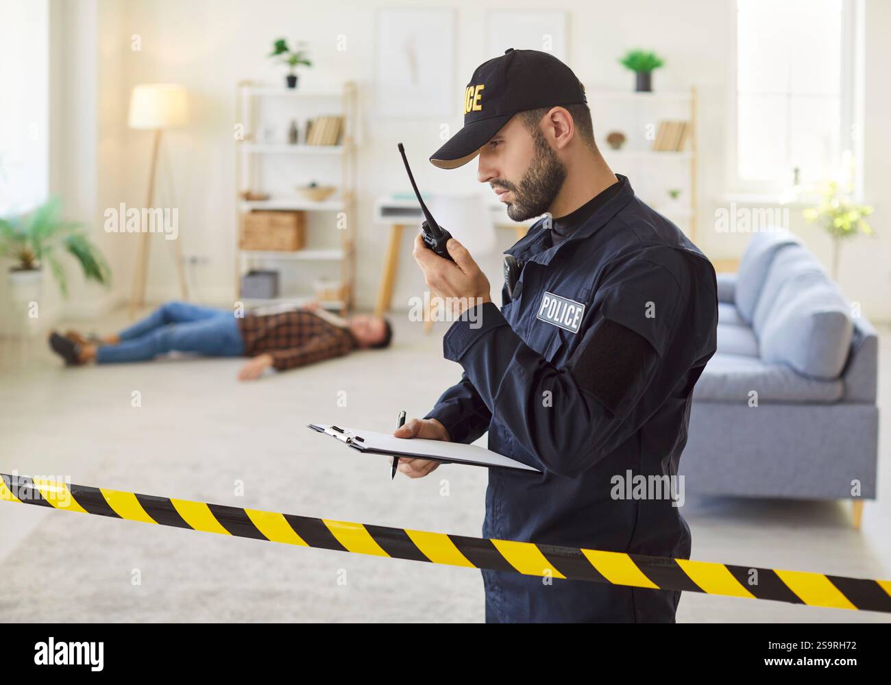 Policeman using walkie-talkie radio, talking system to broadcast ...