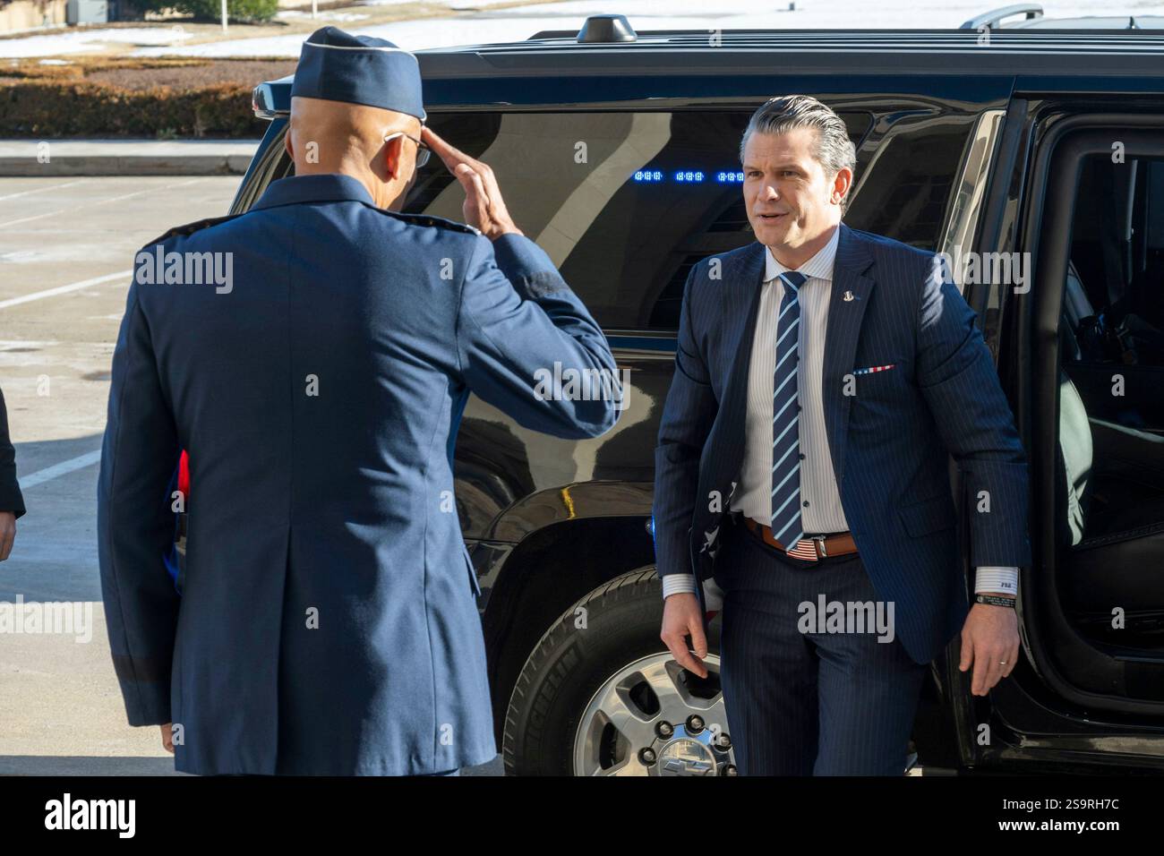 Defense Secretary Pete Hegseth, center, is welcomed to the Pentagon by Chairman of the Joint ...
