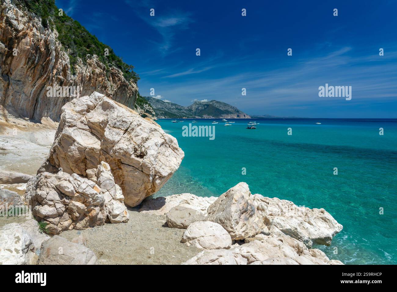 Rocks at Cala Luna beach and clear transparent blue water in the Gulf ...