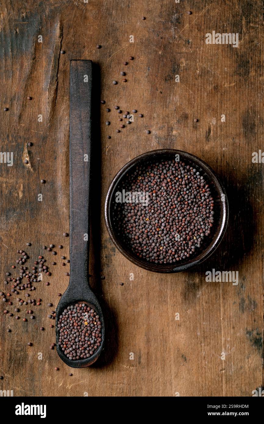 Black mustard seeds for cooking dijon mustard in black ceramic bowl ...