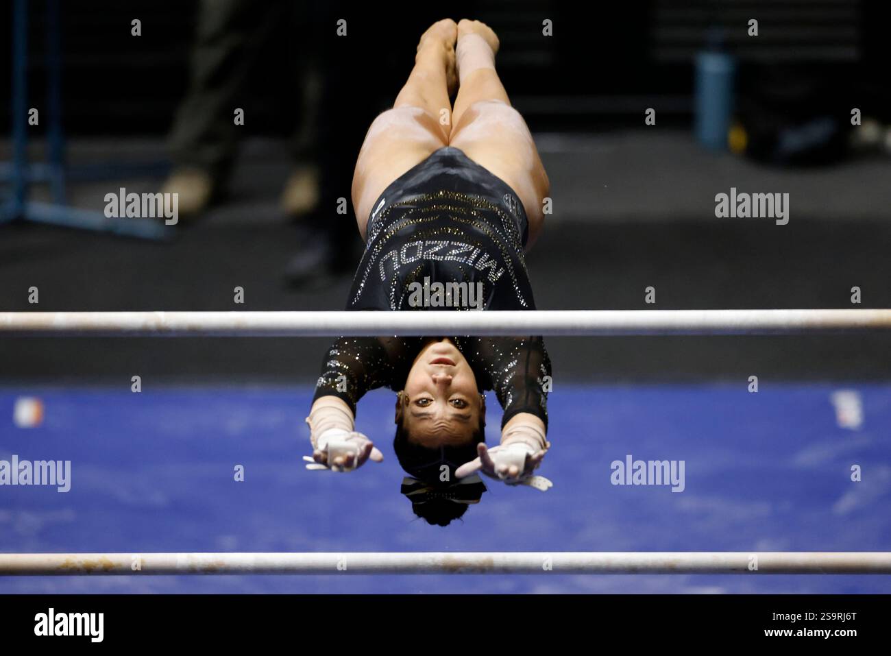 Missouri's Mara Titarsolej competes on the uneven bars during an NCAA ...