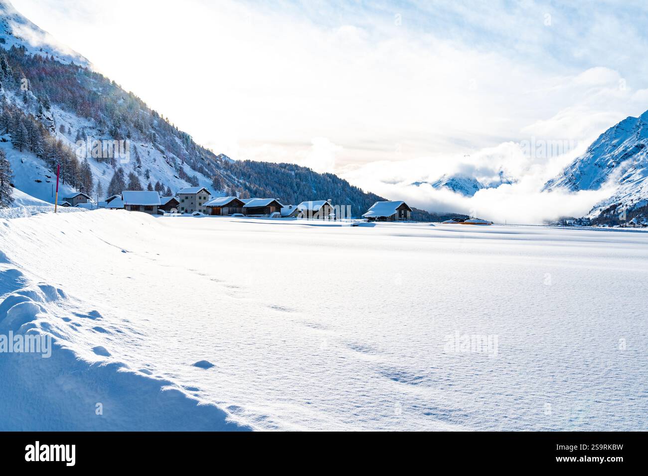 The village of Isola in winter, on Lake Sils, Engadin, Switzerland ...