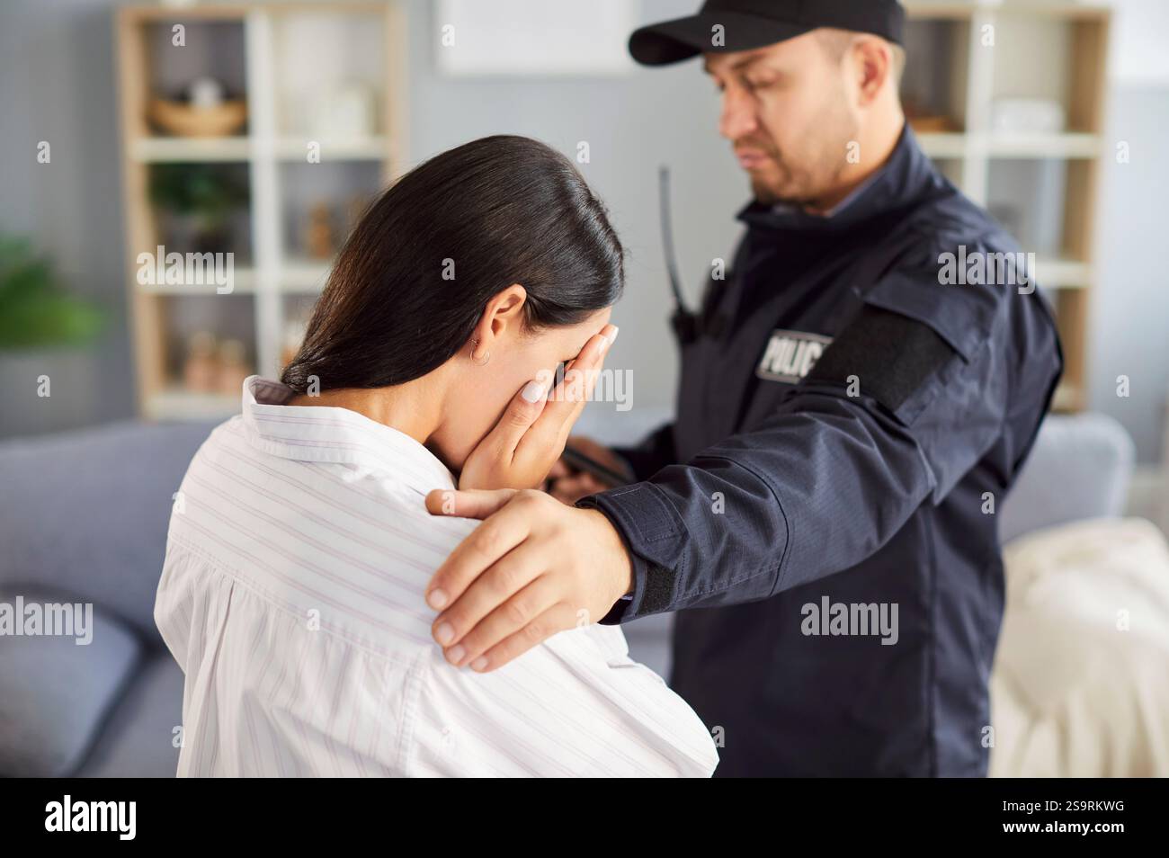 Police Officer Or Detective Comforting Crying Victim During Crime ...
