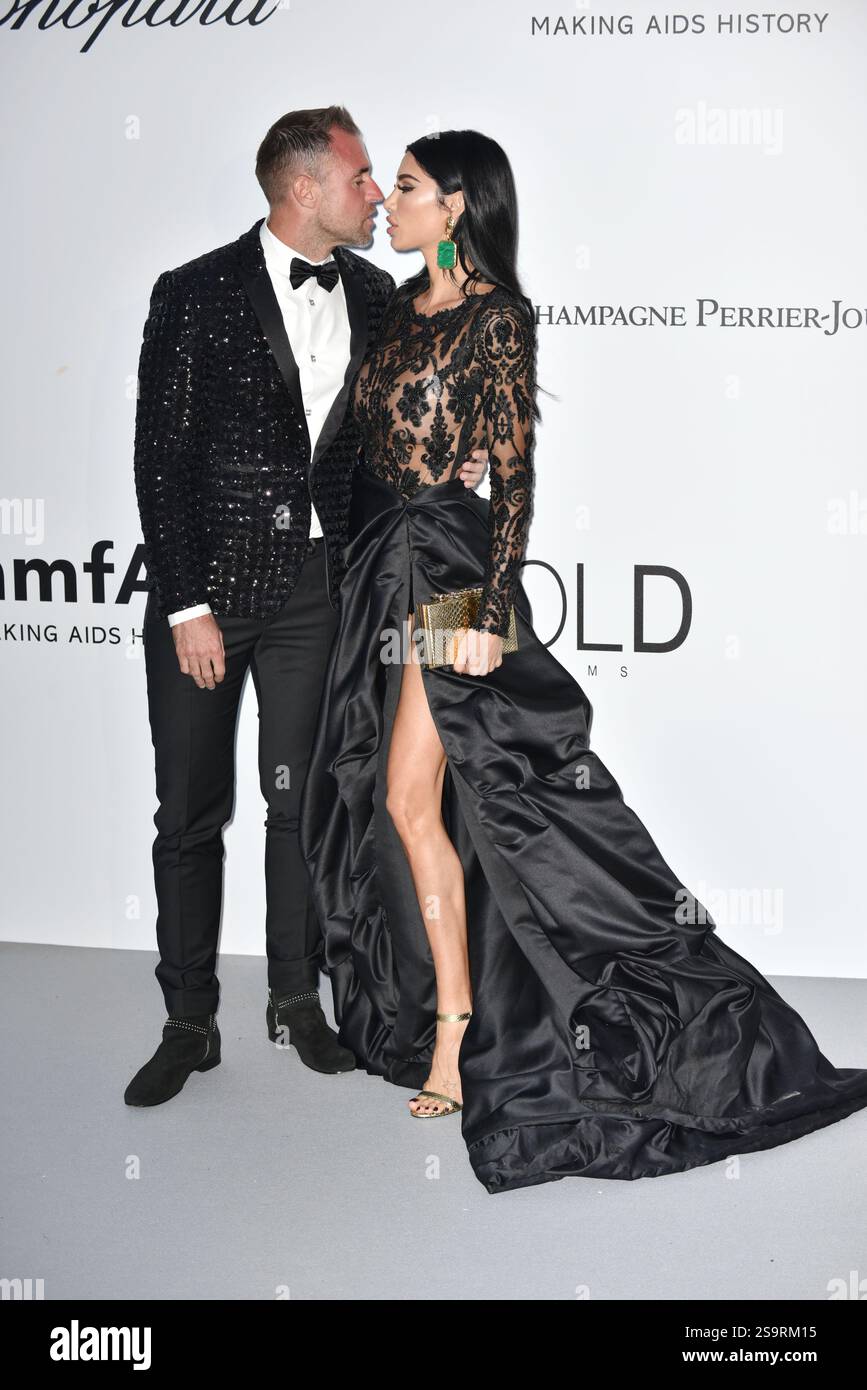 Phillip Plein and Morgan Osmanarrivals at 25th annual amfAR Gala at ...