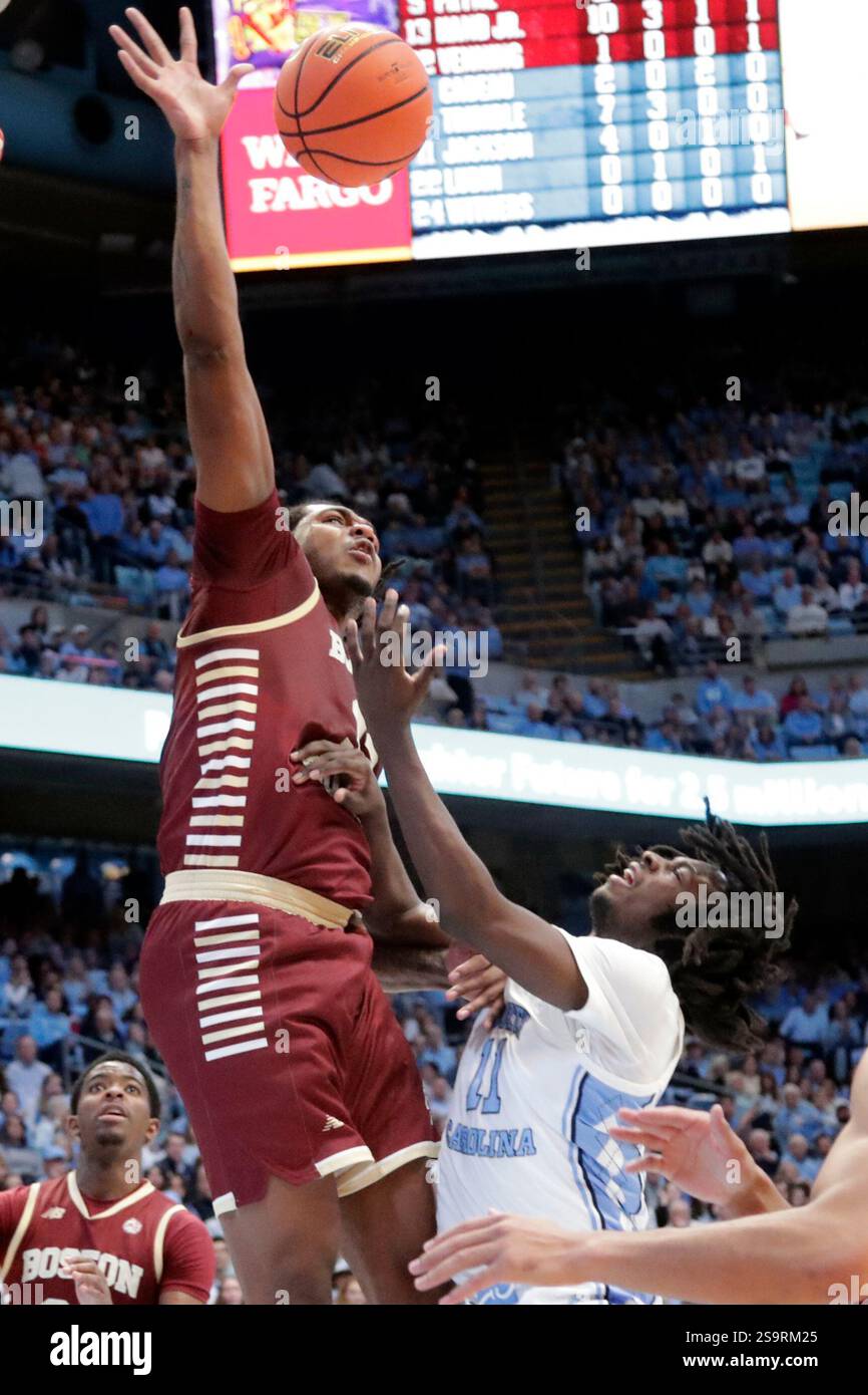 Boston College forward Chad Venning, left, goes up to block a shot by ...