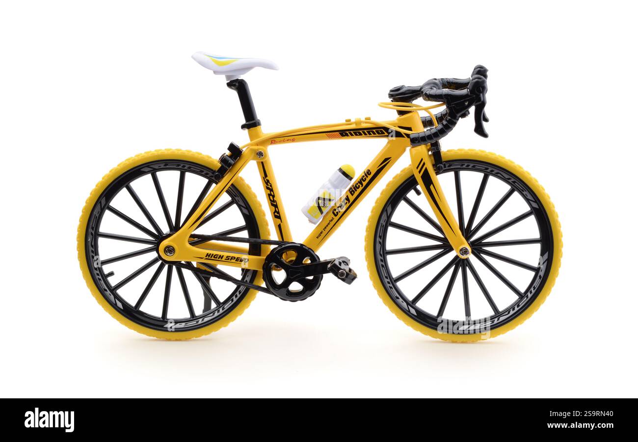 New yellow metal bike model isolated on white Stock Photo - Alamy