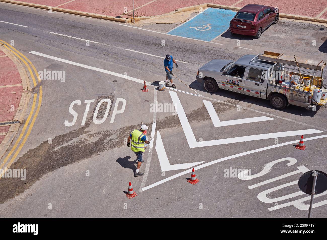 Workers refresh road lines, upgrade infrastructure, build ...
