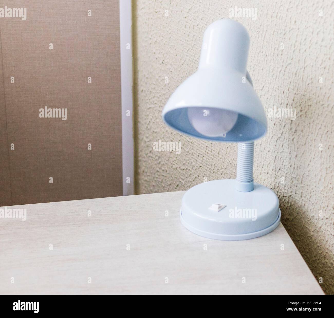 Shot of the small lamp on the desk Stock Photo - Alamy