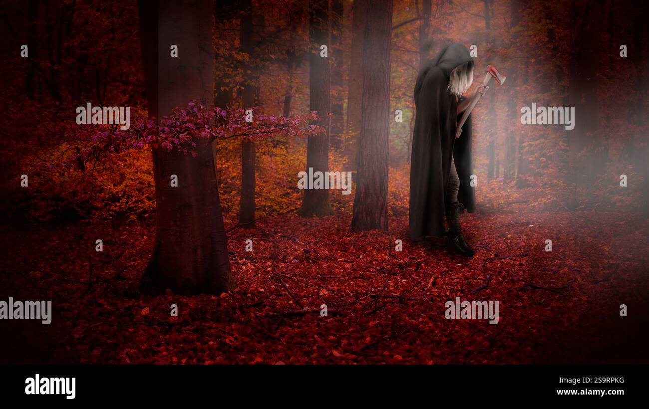 A halloween female fantasy death figure with cape and blood axe in a ...