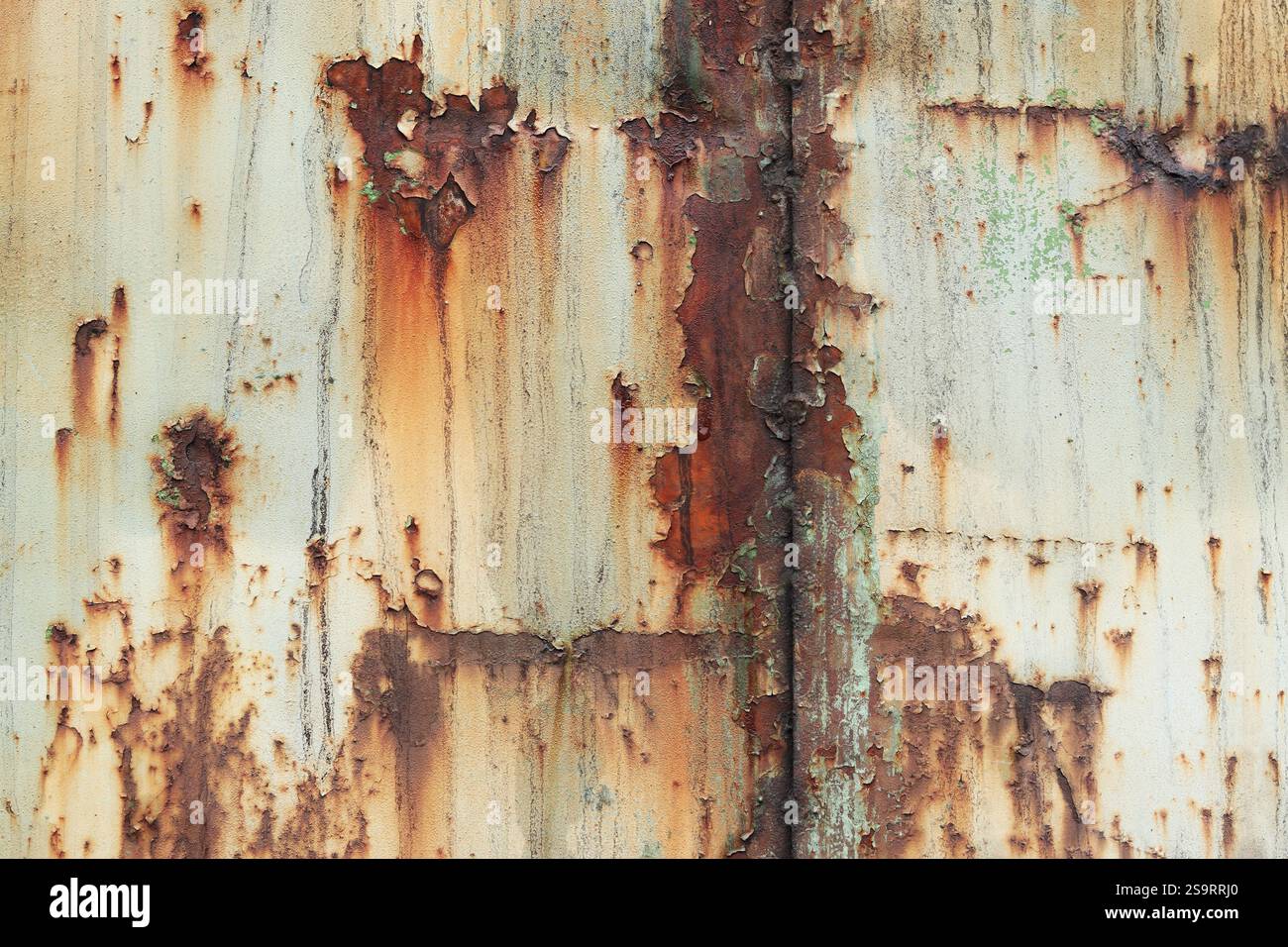 Old rusty metal surface with peeling paint and dirty streaks from rain ...