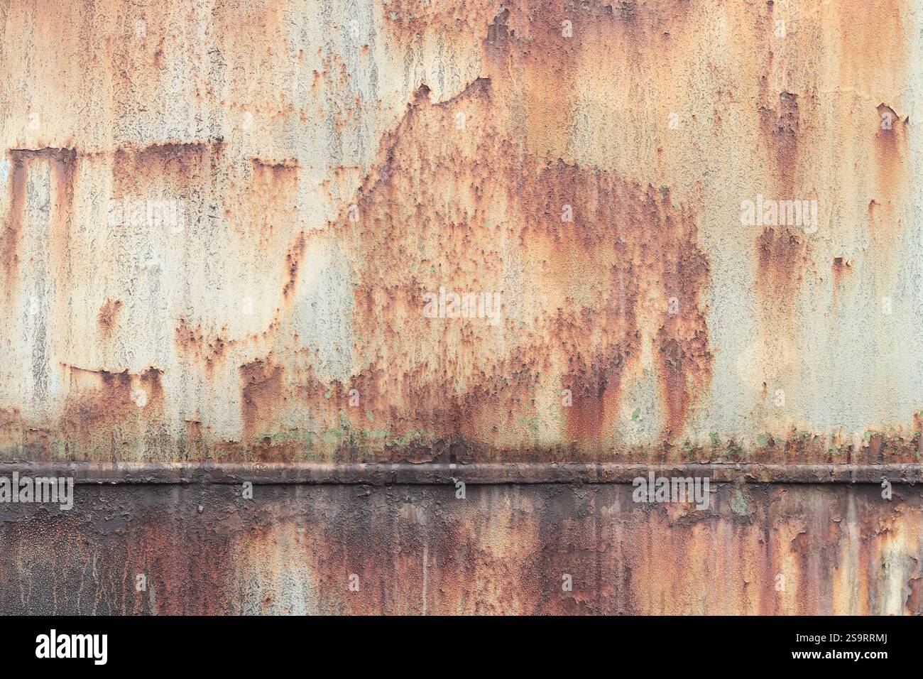 Old rusty metal surface with peeling paint and dirty streaks from rain ...