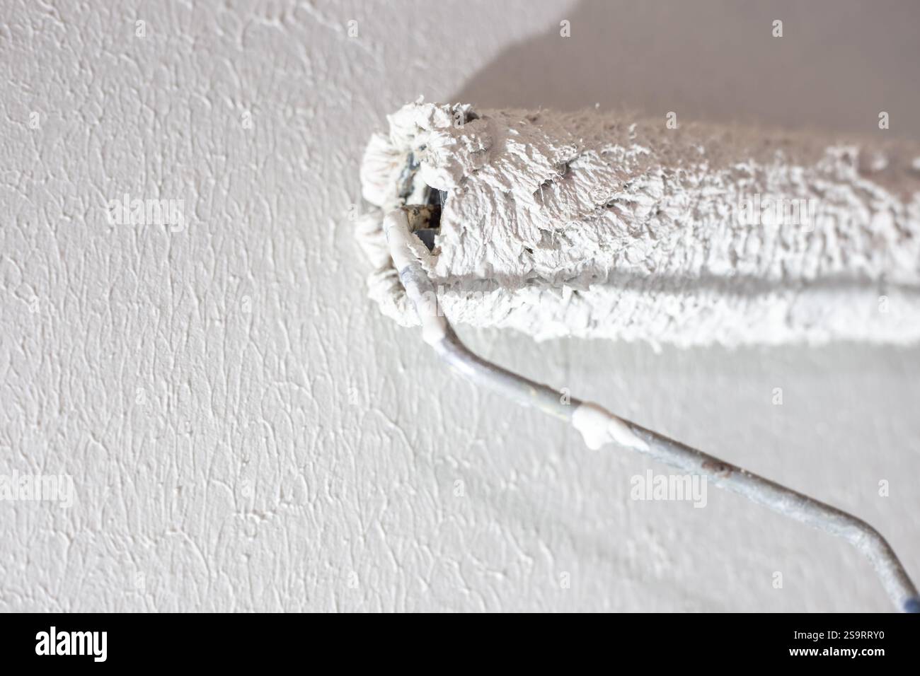 Home renovation. Plastering the surface of a plasterboard wall with a ...