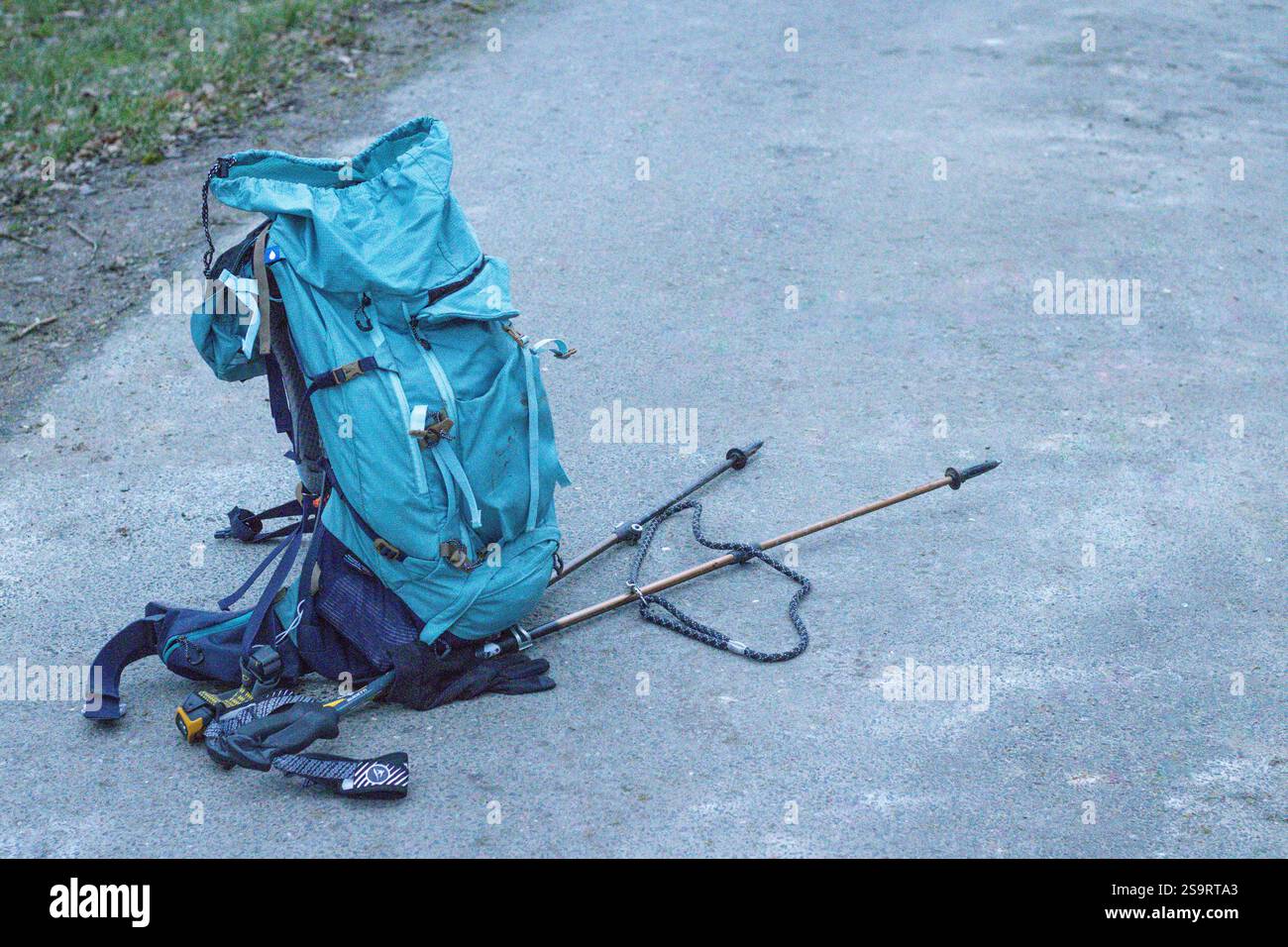 Blue hiking backpack open on asphalt Stock Photo - Alamy
