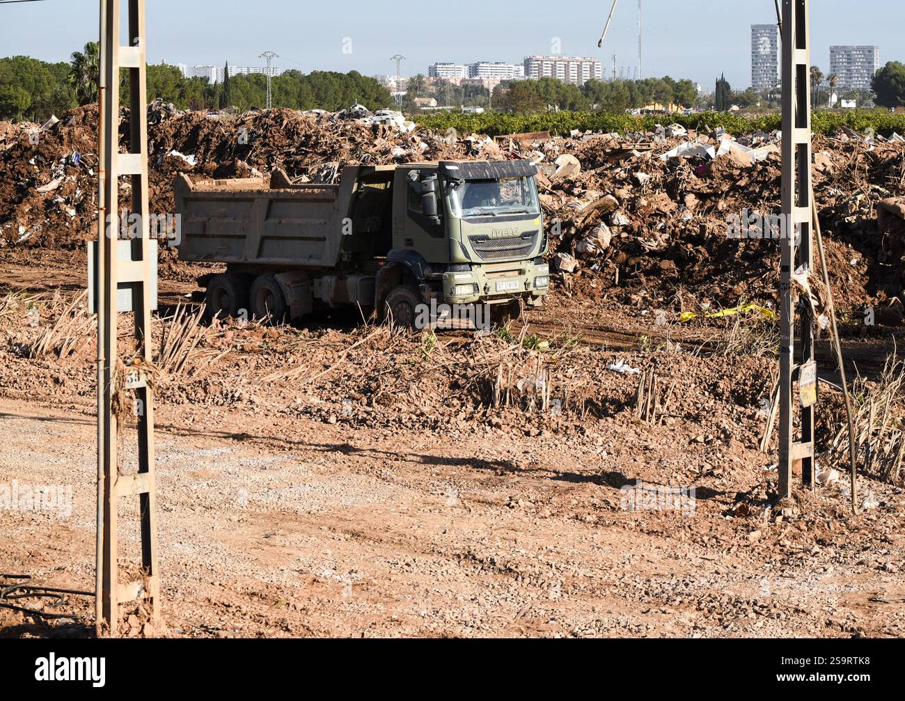 IVECO military truck during cleanup operations in a ground full of soil ...
