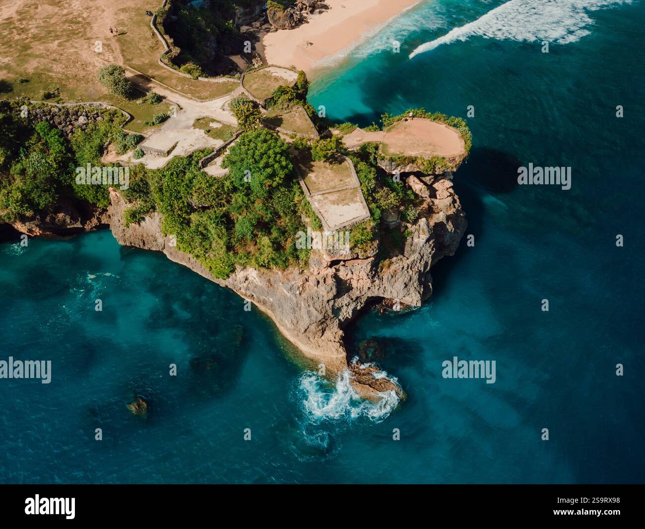 Aerial view of beach with scenic rock and ocean in Bali, Balangan beach ...