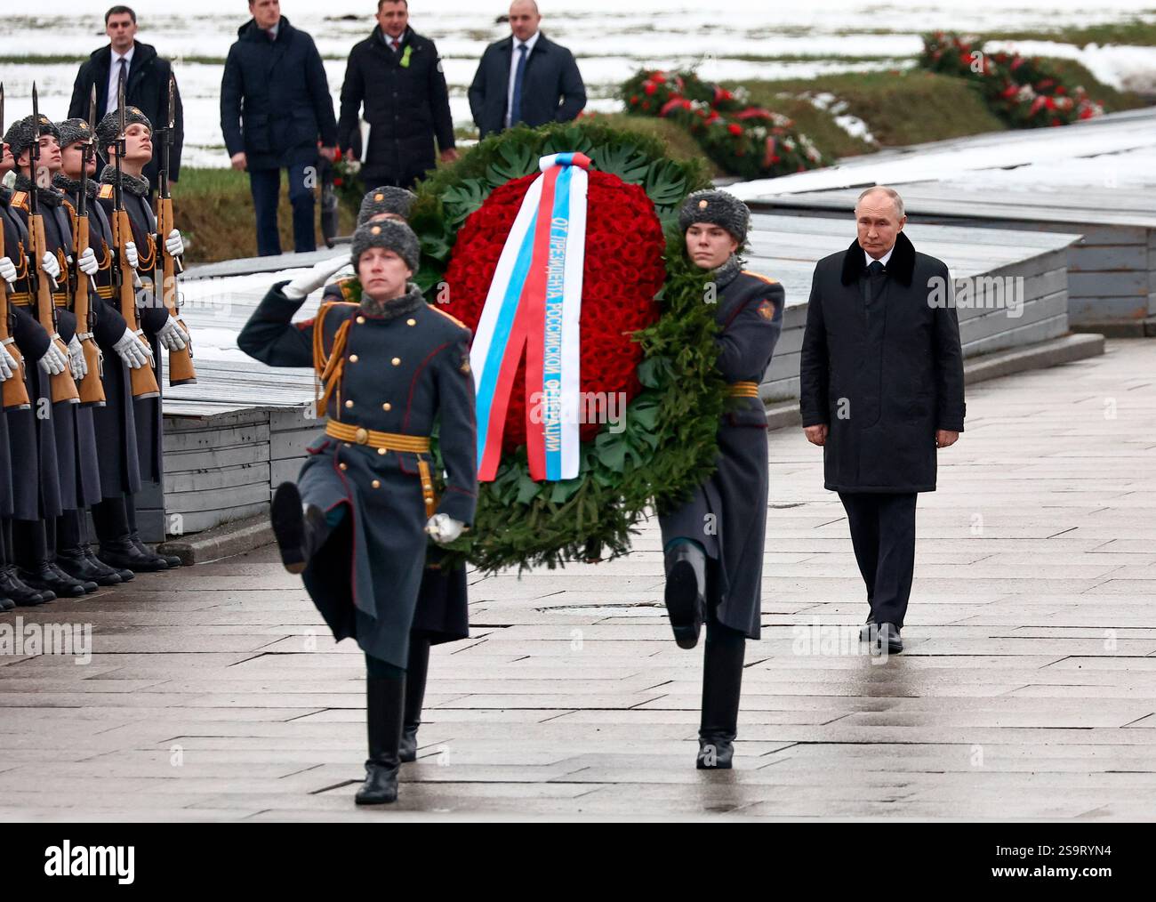 Russian President Vladimir Putin, right, attends a wreath laying commemoration ceremony at the ...