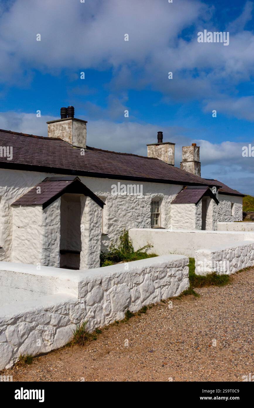 Traditional white painted cottages on the island of Ynys Llanddwyn off ...