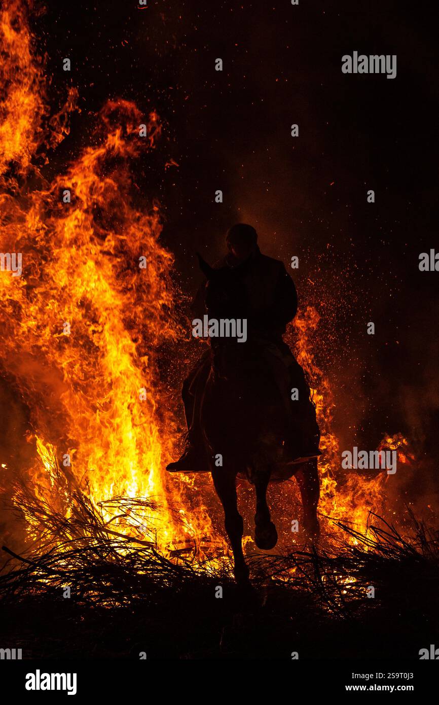 16 January 2025, Knights cross bonfires with their horses in an ancient ...