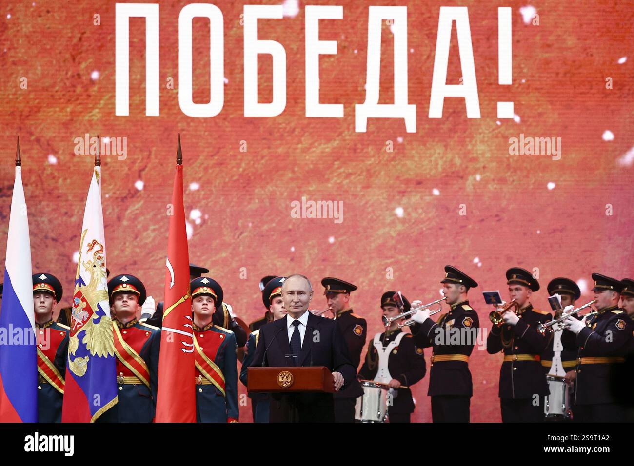 Russian President Vladimir Putin, front center, speaks during awarding ...