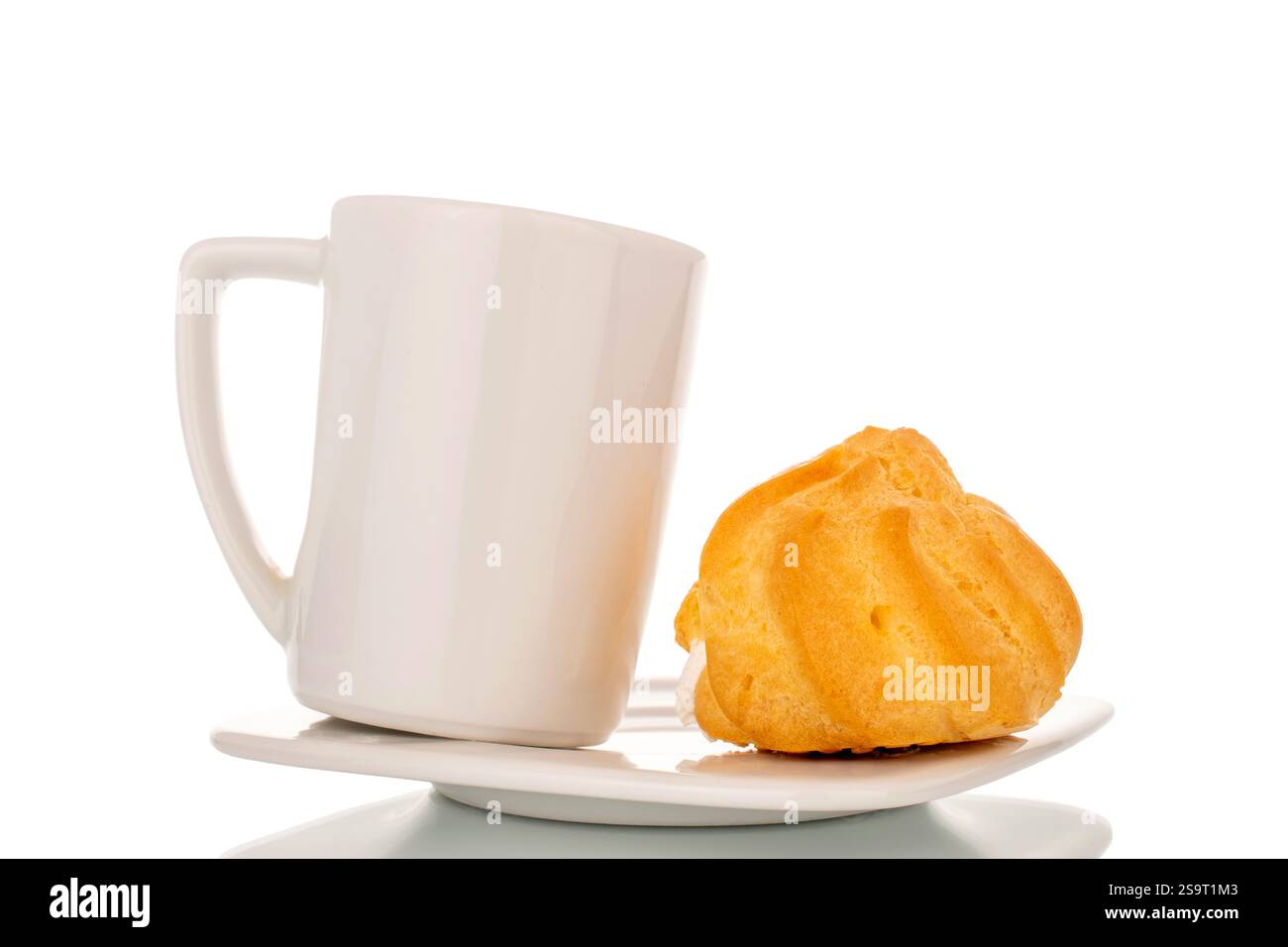 One eclair with ceramic cup on saucer, close-up, isolated on white ...