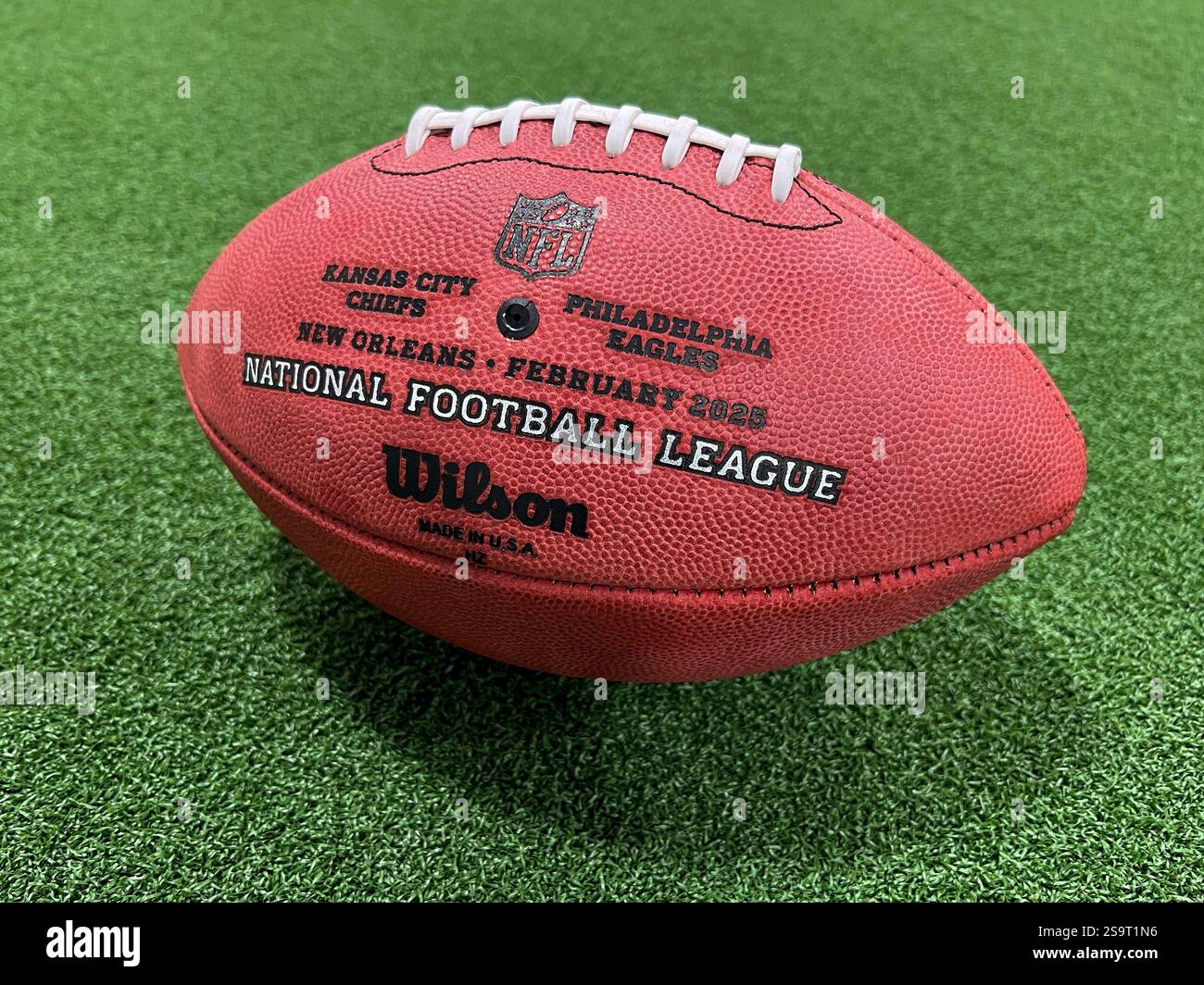 One of the official balls for the NFL Super Bowl football game is seen ...