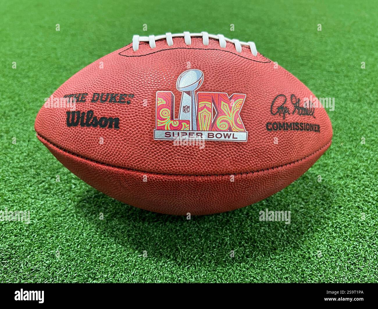 One of the official balls for the NFL Super Bowl football game is seen ...