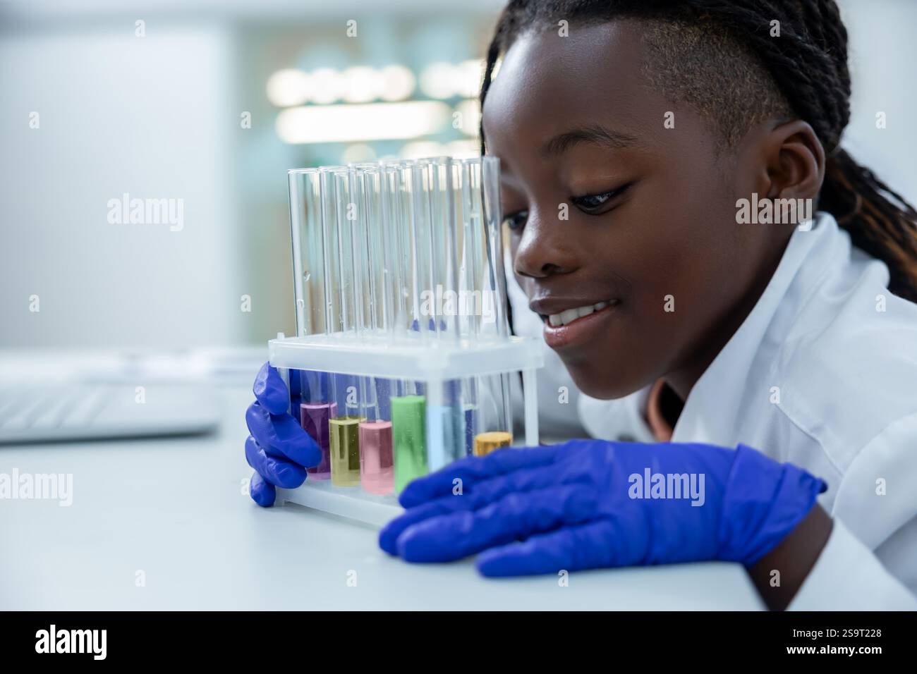 Medical woman in laboratory using pipette conducting experiment on ...
