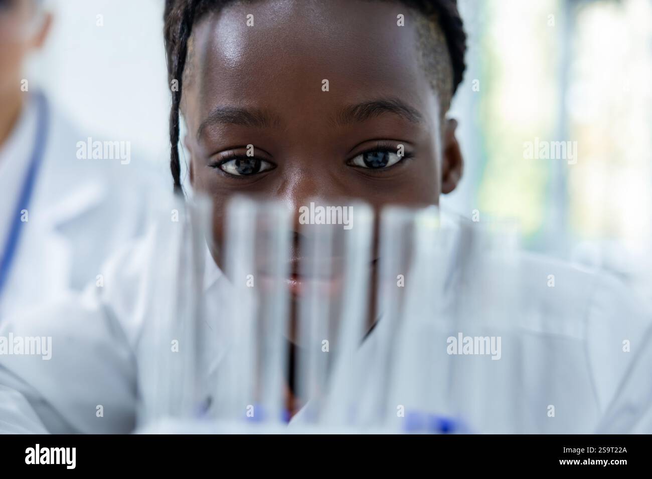 Medical woman in laboratory using pipette conducting experiment on ...