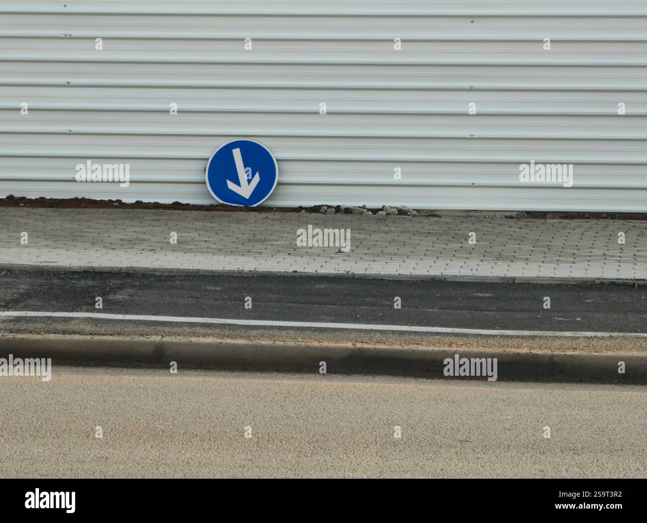Blue Round Traffic Sign: Guiding the Way on the Street Stock Photo - Alamy
