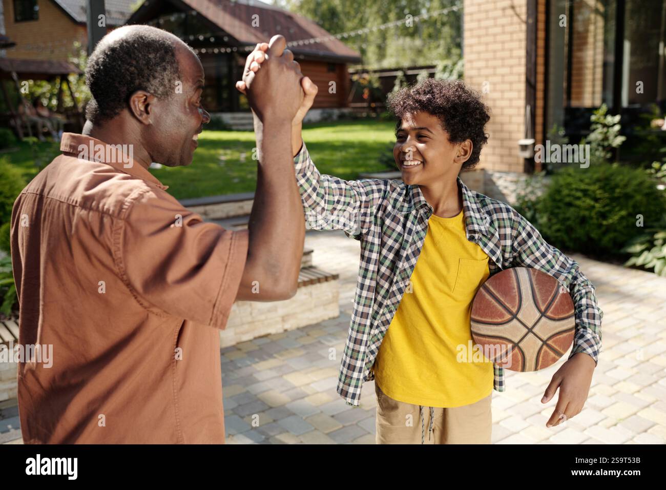 Celebrating Generational Bonding through Outdoor Activity Stock Photo ...