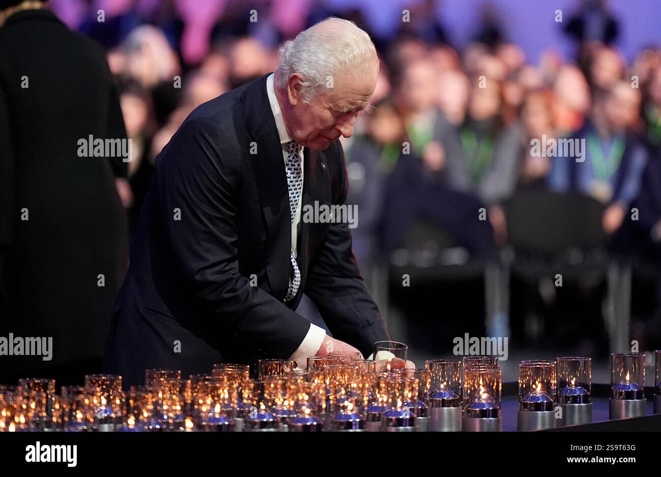 King Charles III lays a candle during commemorations at Auschwitz ...