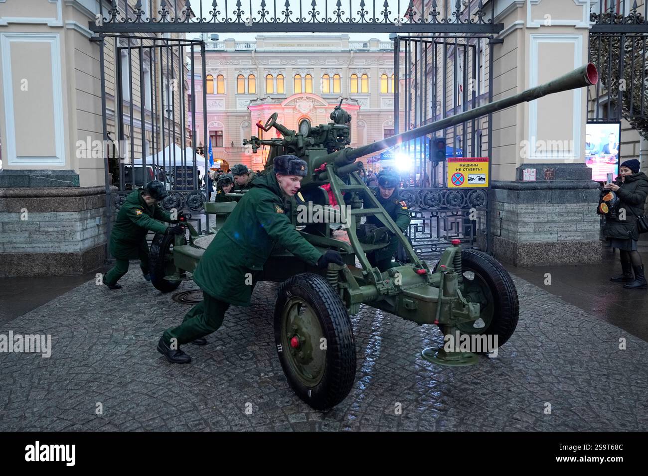 Soldiers roll a World War II anti aircraft gun during celebration of ...