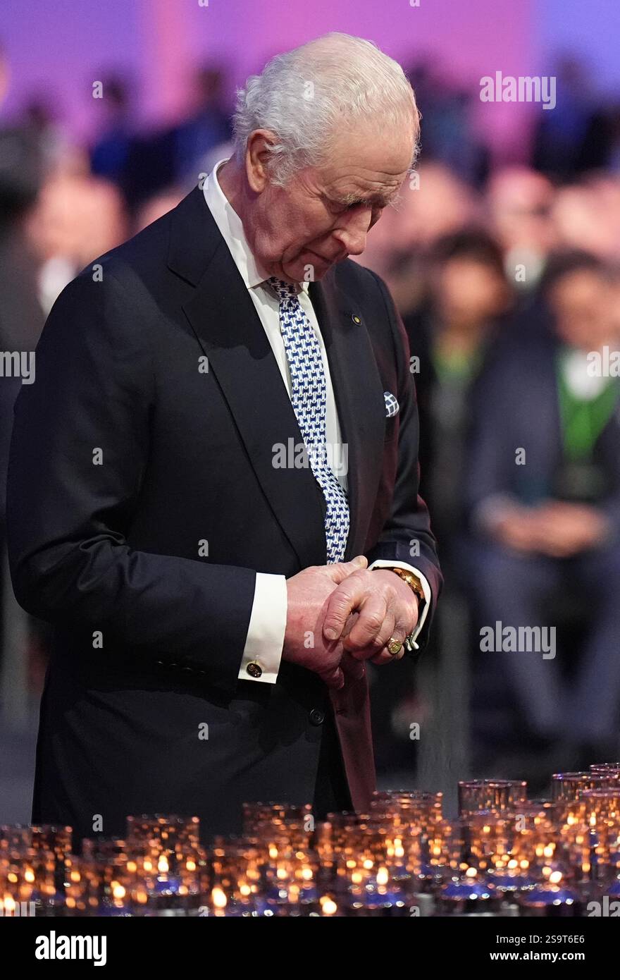 King Charles III lays a candle during commemorations at Auschwitz ...