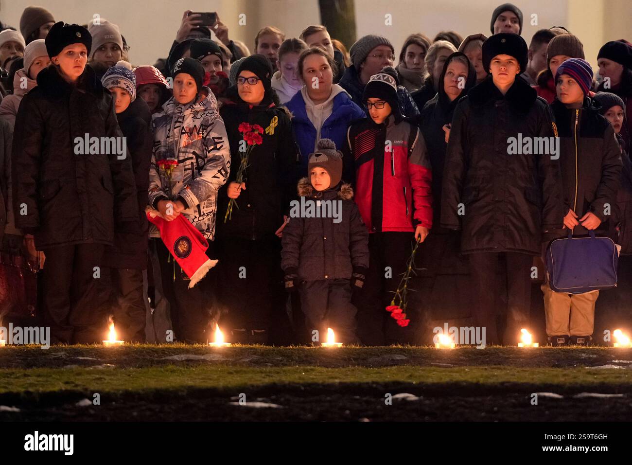 People attend the 'Candle of Memory' action during celebration of the ...