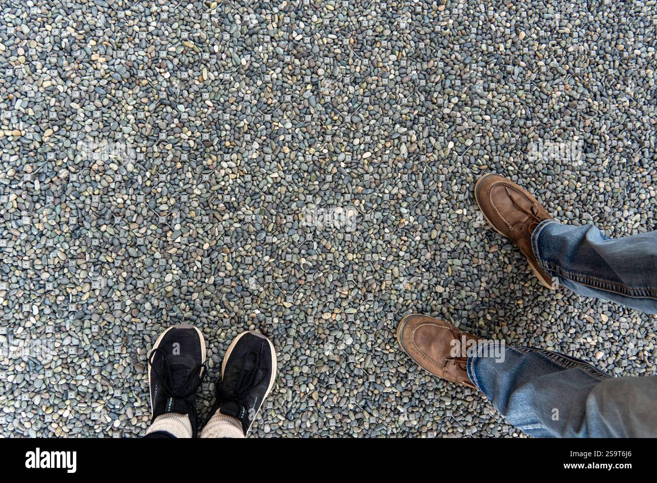 rock gravel ground with feet Stock Photo - Alamy