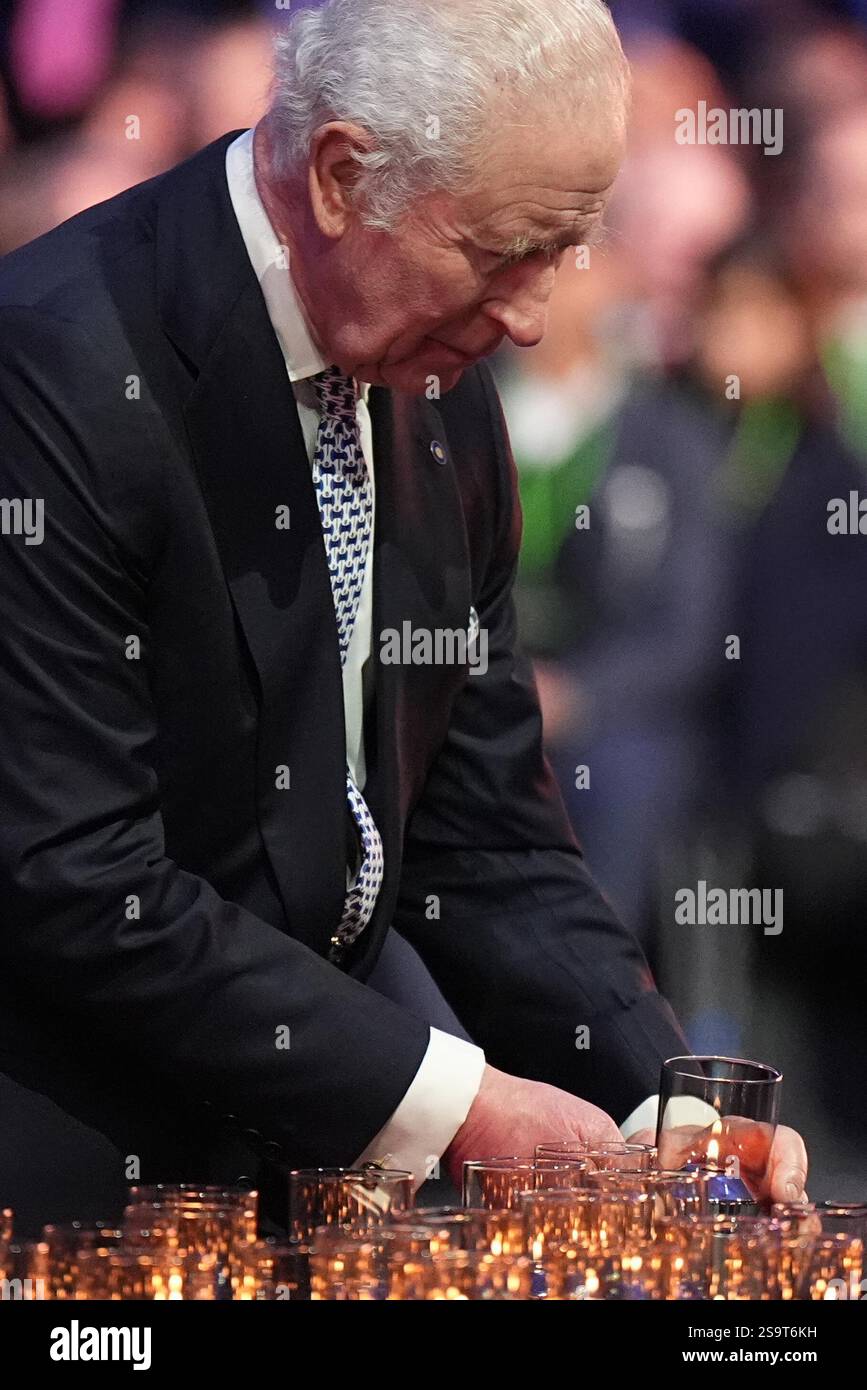 King Charles III lays a candle during commemorations at Auschwitz ...