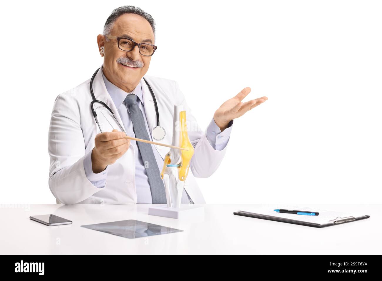 Orthopedic doctor pointing at a knee bone model isolated on white ...