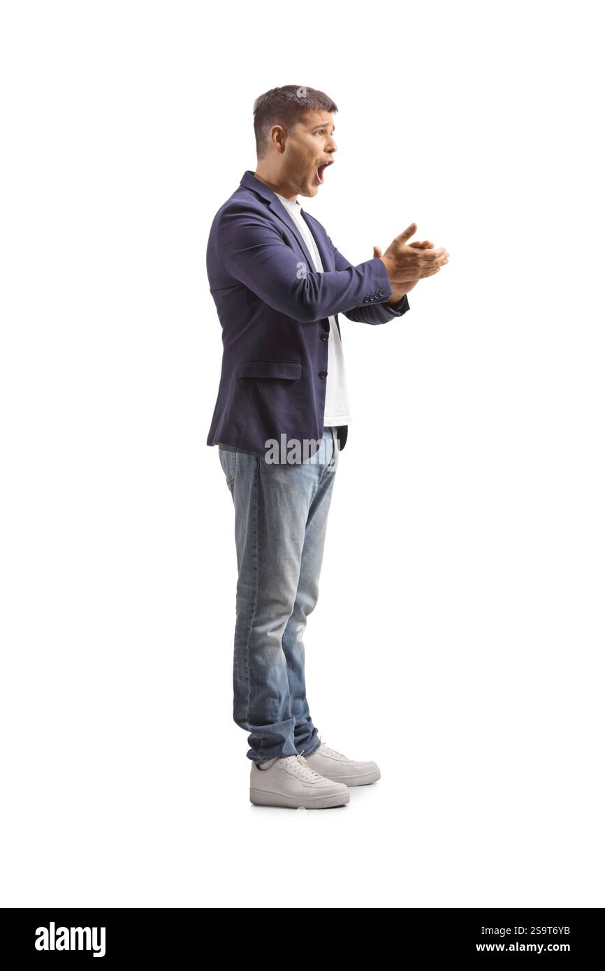 Full length profile shot of an amazed man clapping with hands isolated ...