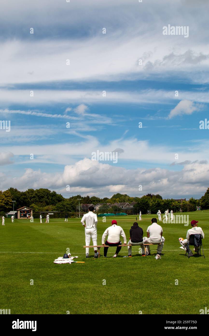 Spectators watching a game of village cricket. Foxton, Cambrideshire ...
