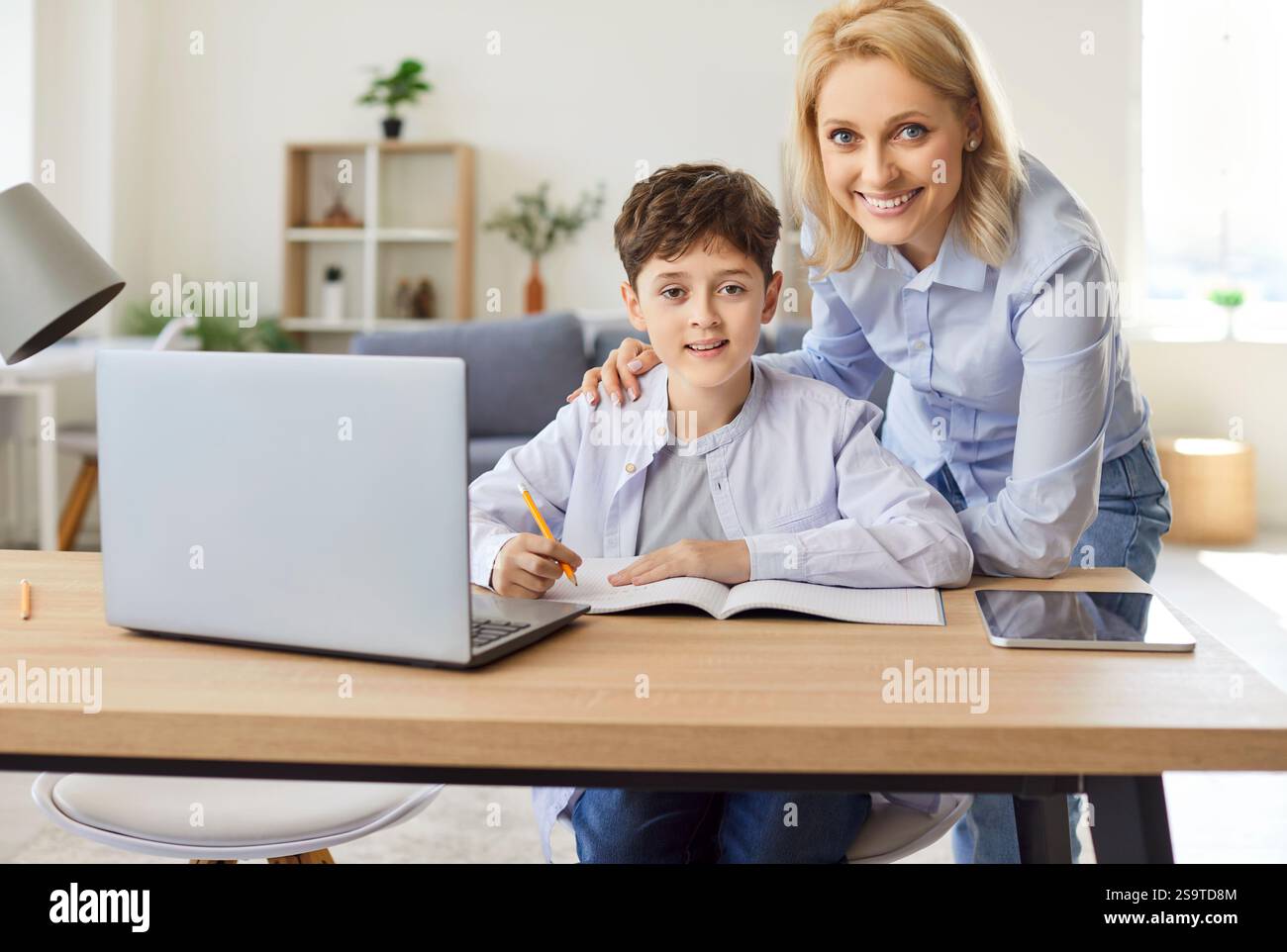 Loving family mother help, caring woman with little son together ...