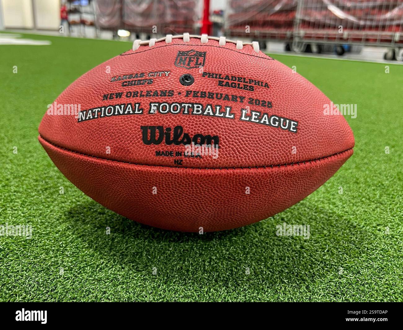One of the official balls for the NFL Super Bowl football game is seen ...