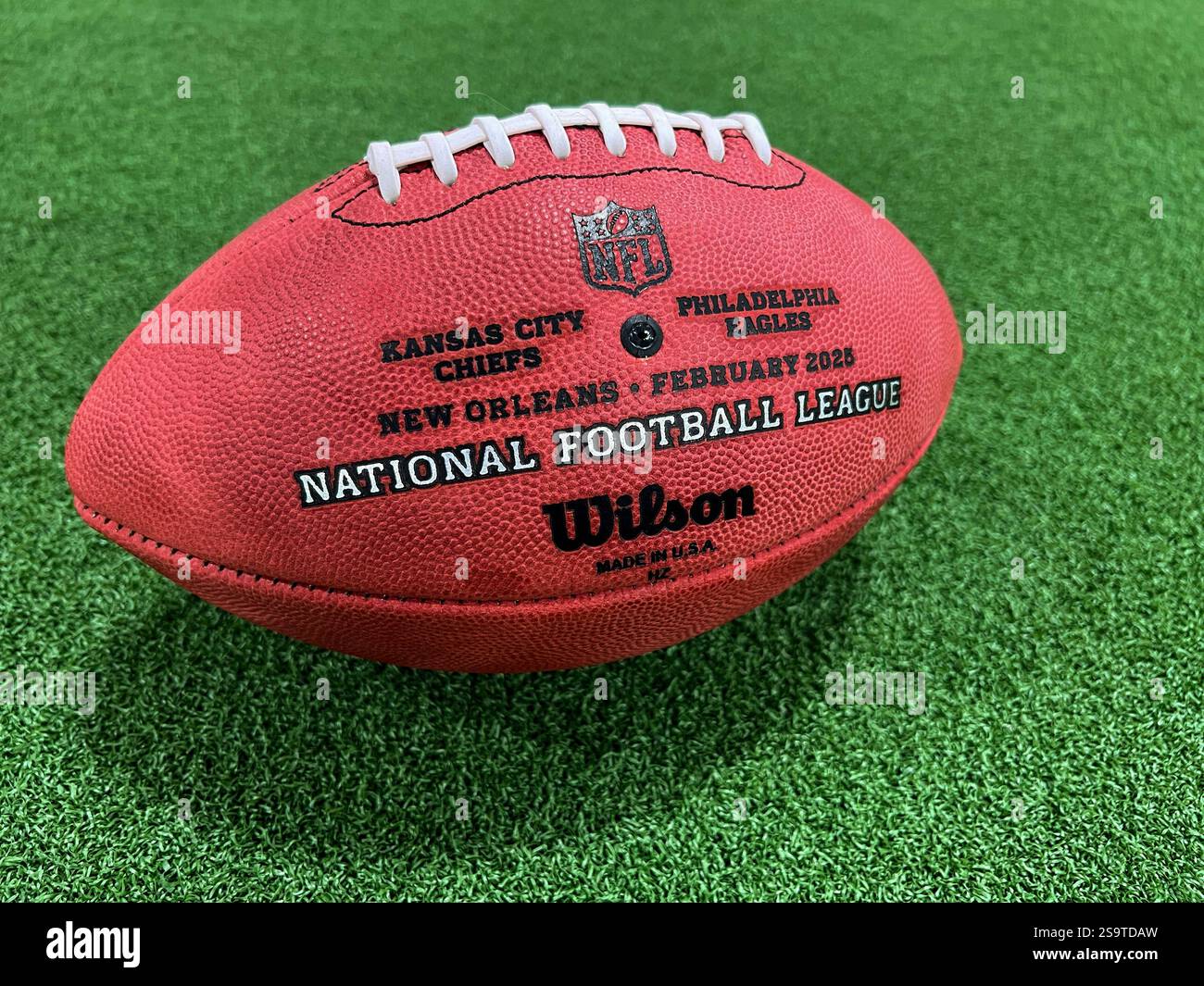 One of the official balls for the NFL Super Bowl football game is seen ...