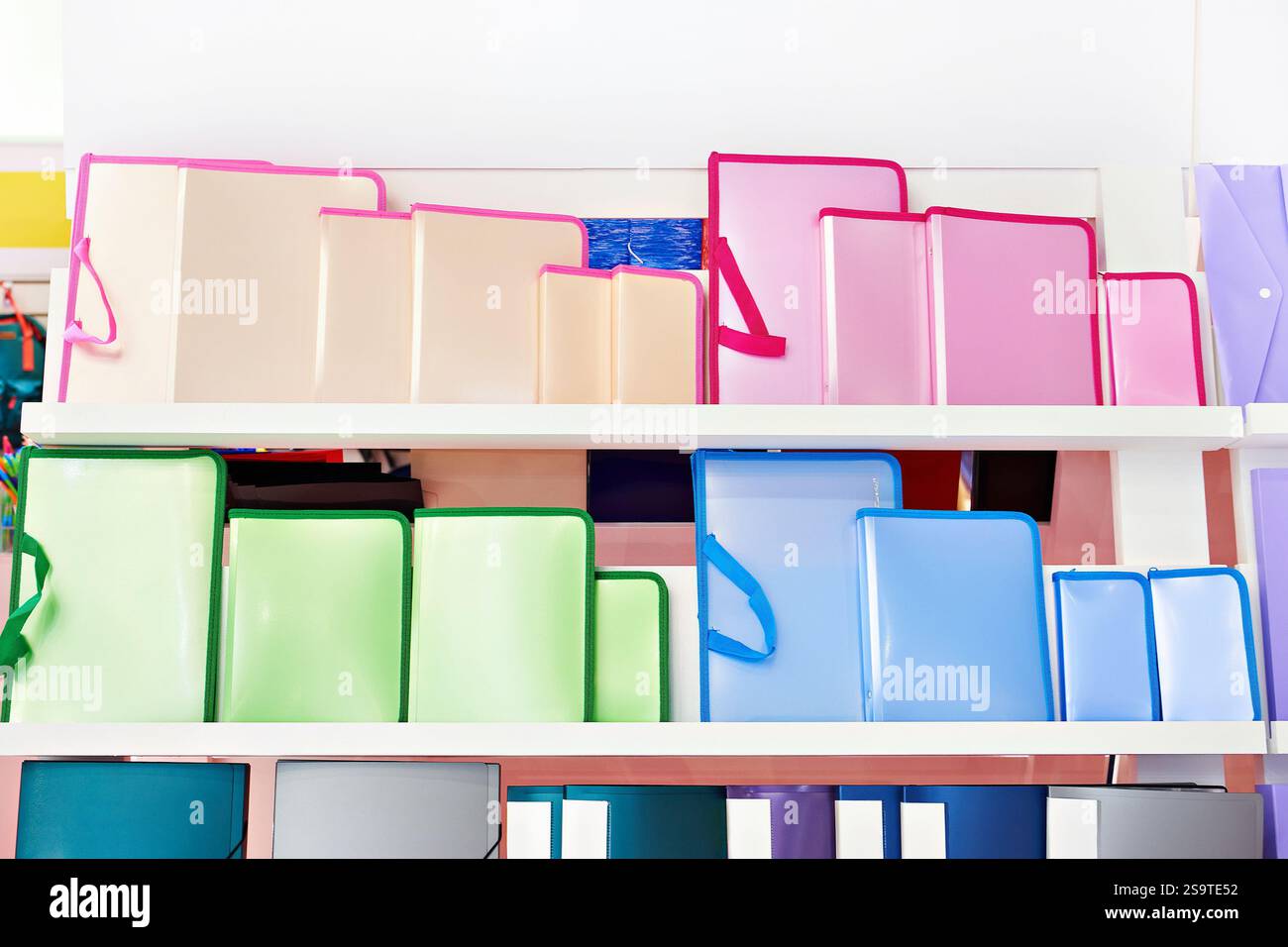 Colored plastic folder for papers in the stationery store Stock Photo ...