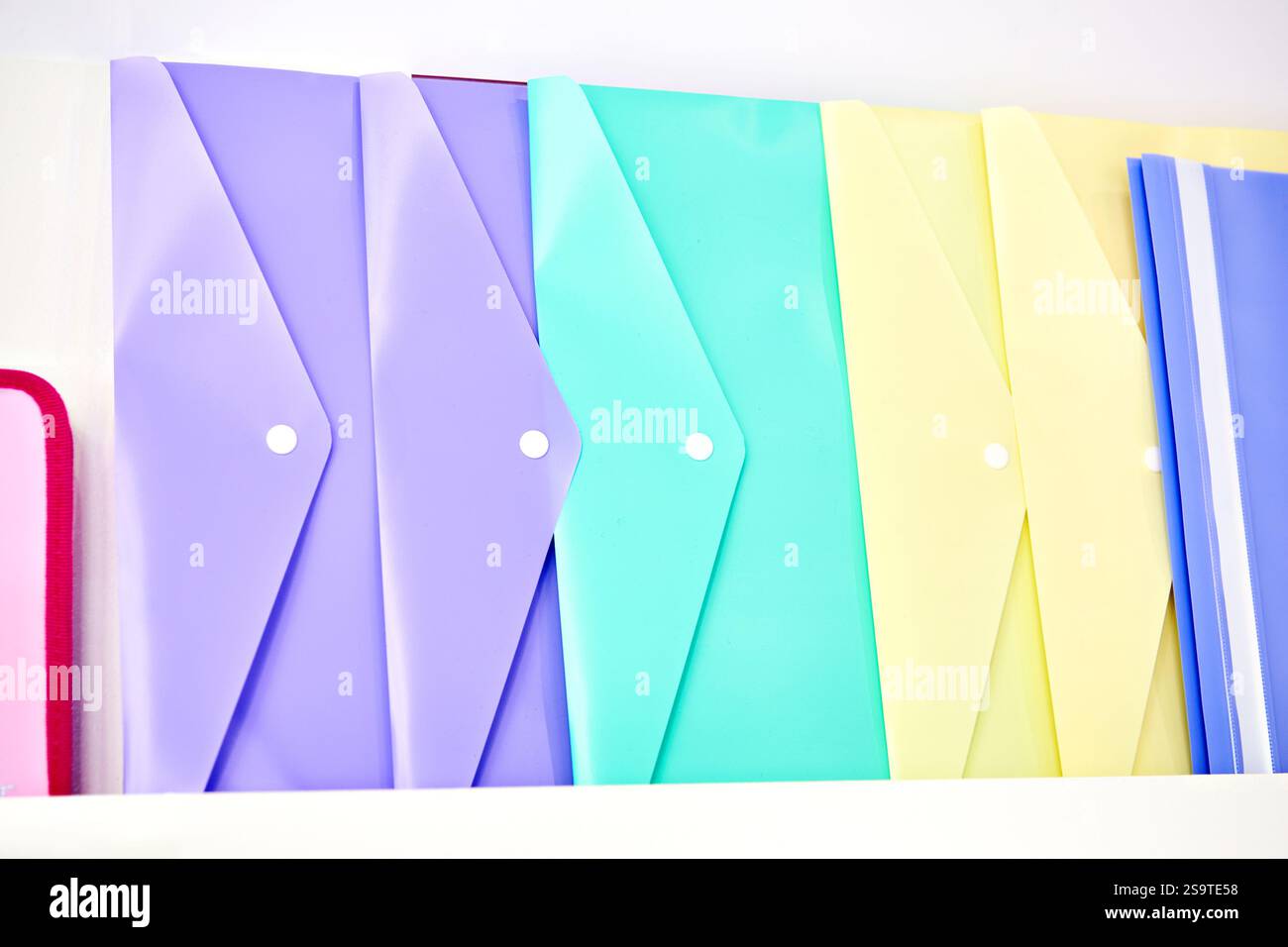 Colored plastic folder for papers in the stationery store Stock Photo ...