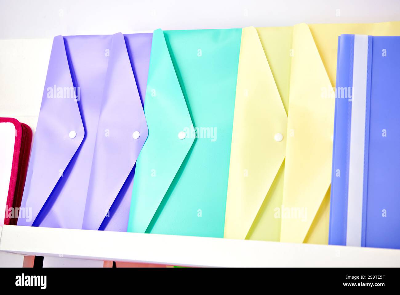 Colored plastic folder for papers in the stationery store Stock Photo ...