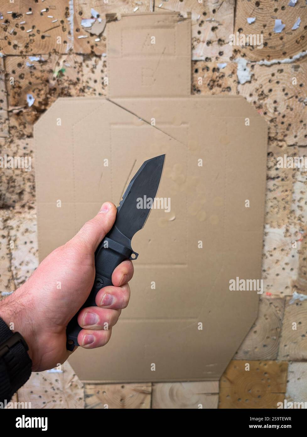 Knife fighting training, first-person view. Knife in a man's hand and a ...