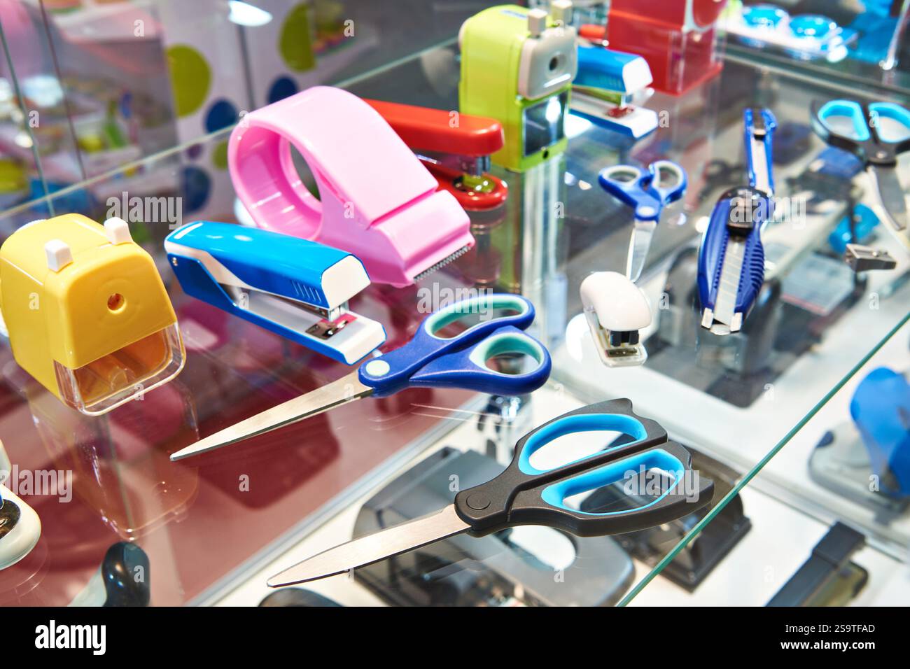 Stationery scissors, staplers and pencil sharpener in a shop window ...