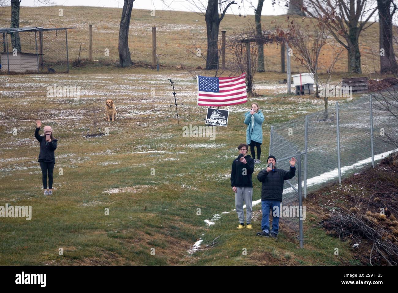 People wave as a motorcade carrying Vice President JD Vance drive past ...